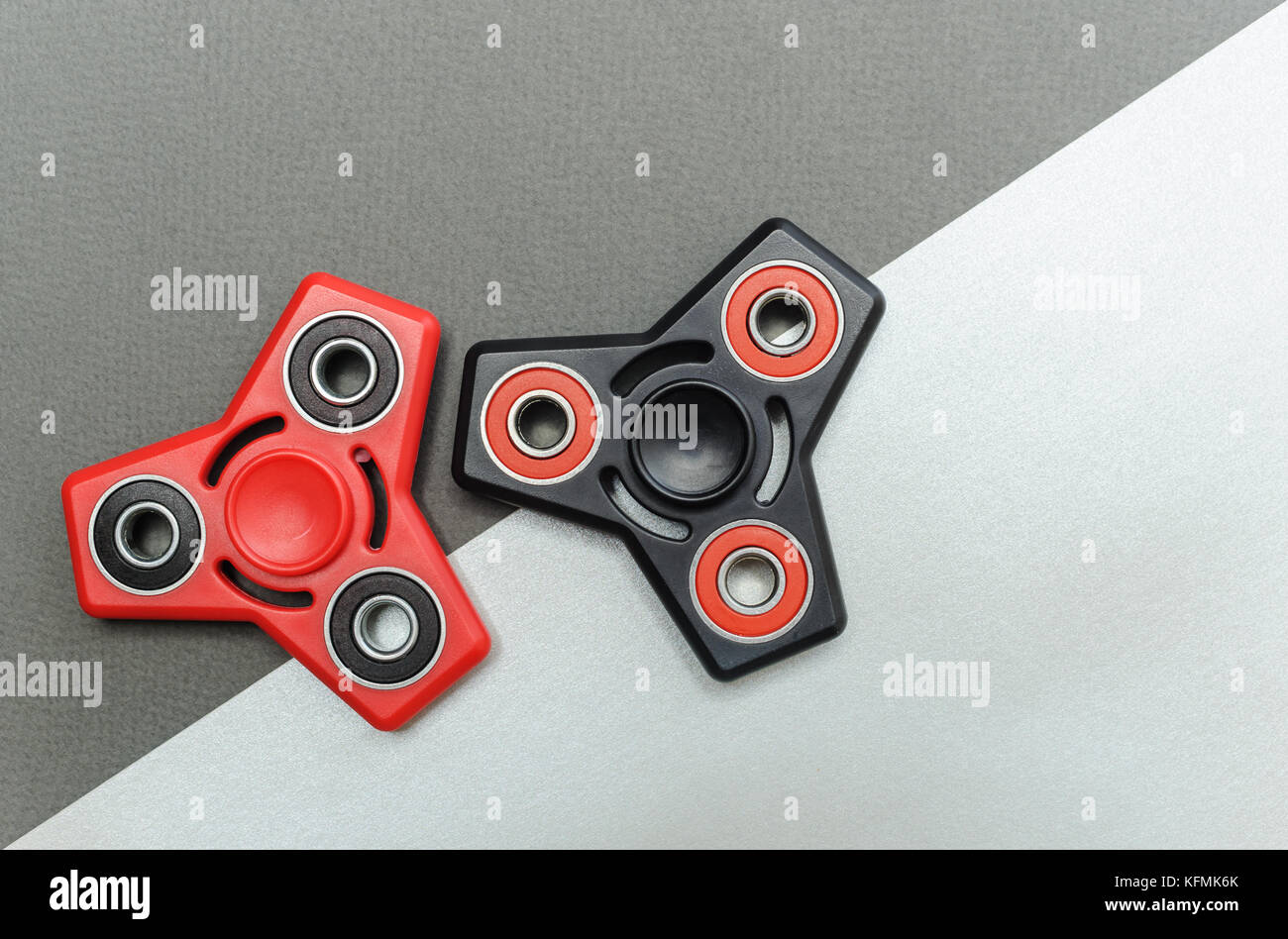 Two spinners on a gray background Stock Photo - Alamy