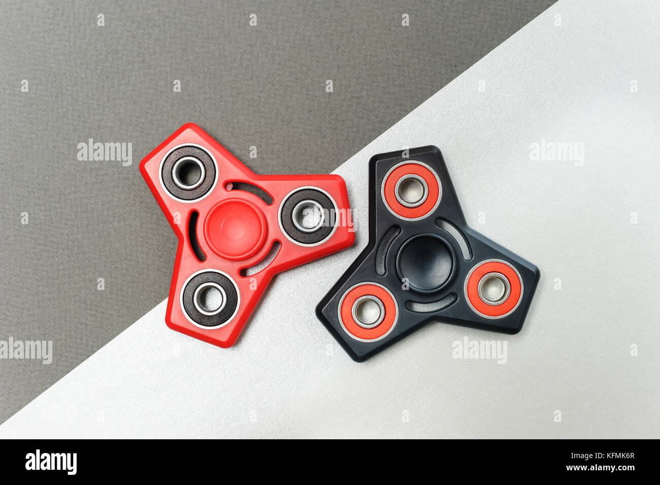 Two spinners on a gray background Stock Photo - Alamy