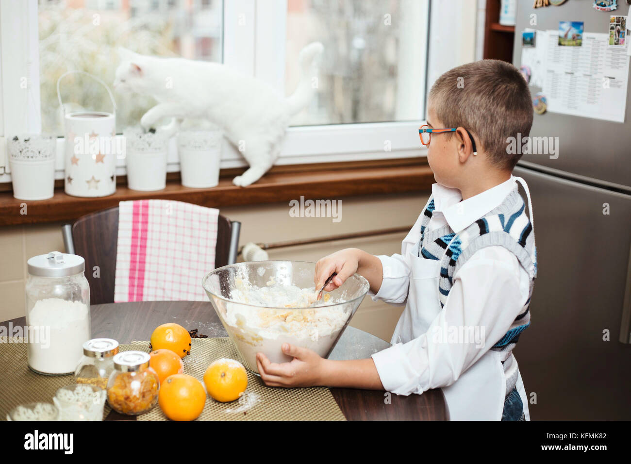 Child mixing flour and eggs hi-res stock photography and images - Alamy
