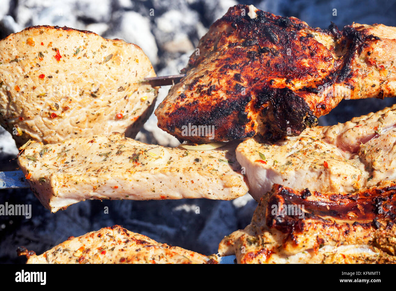 Cooking meat on fire Stock Photo - Alamy