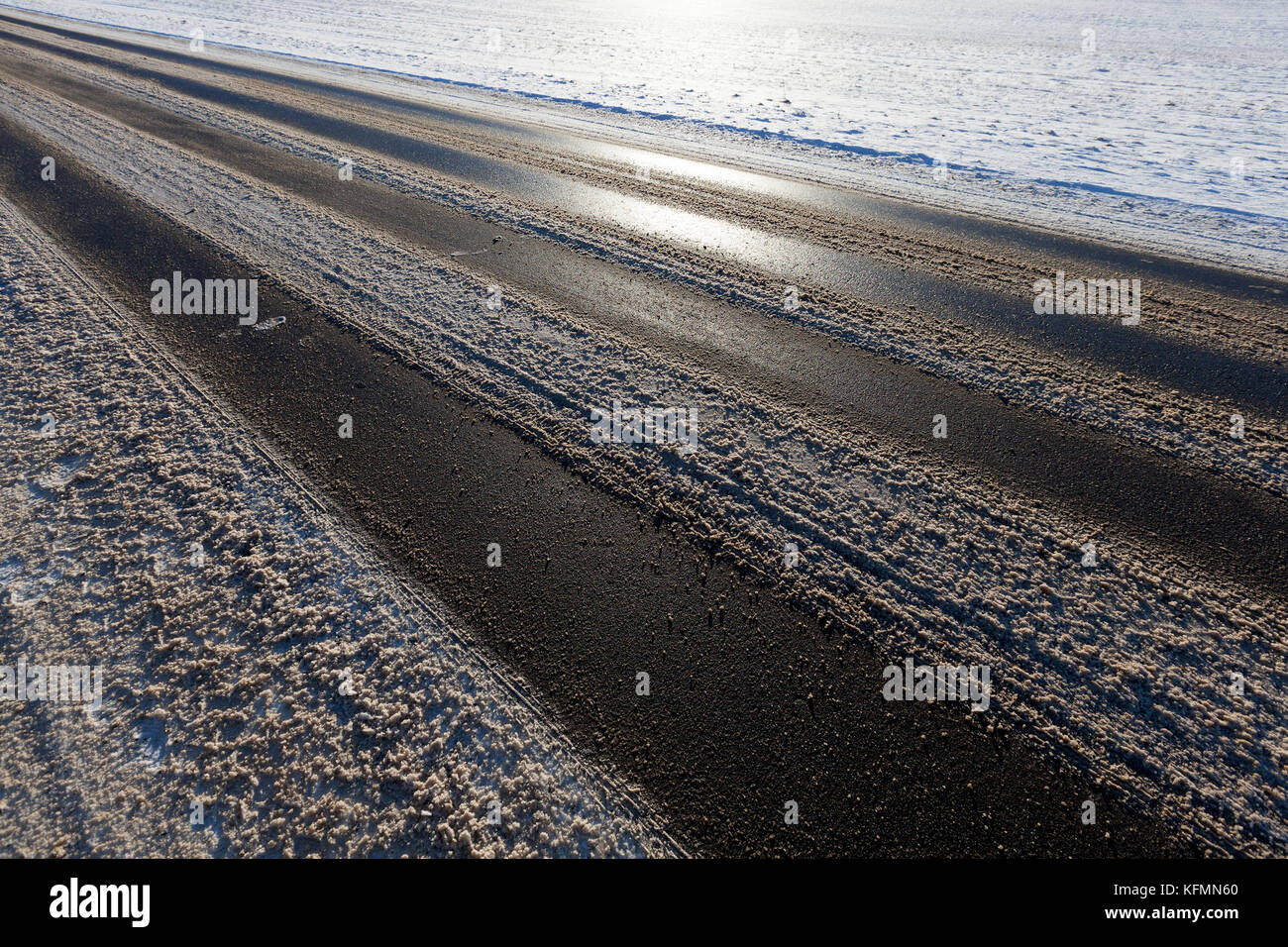 Snow covered asphalt road Stock Photo - Alamy