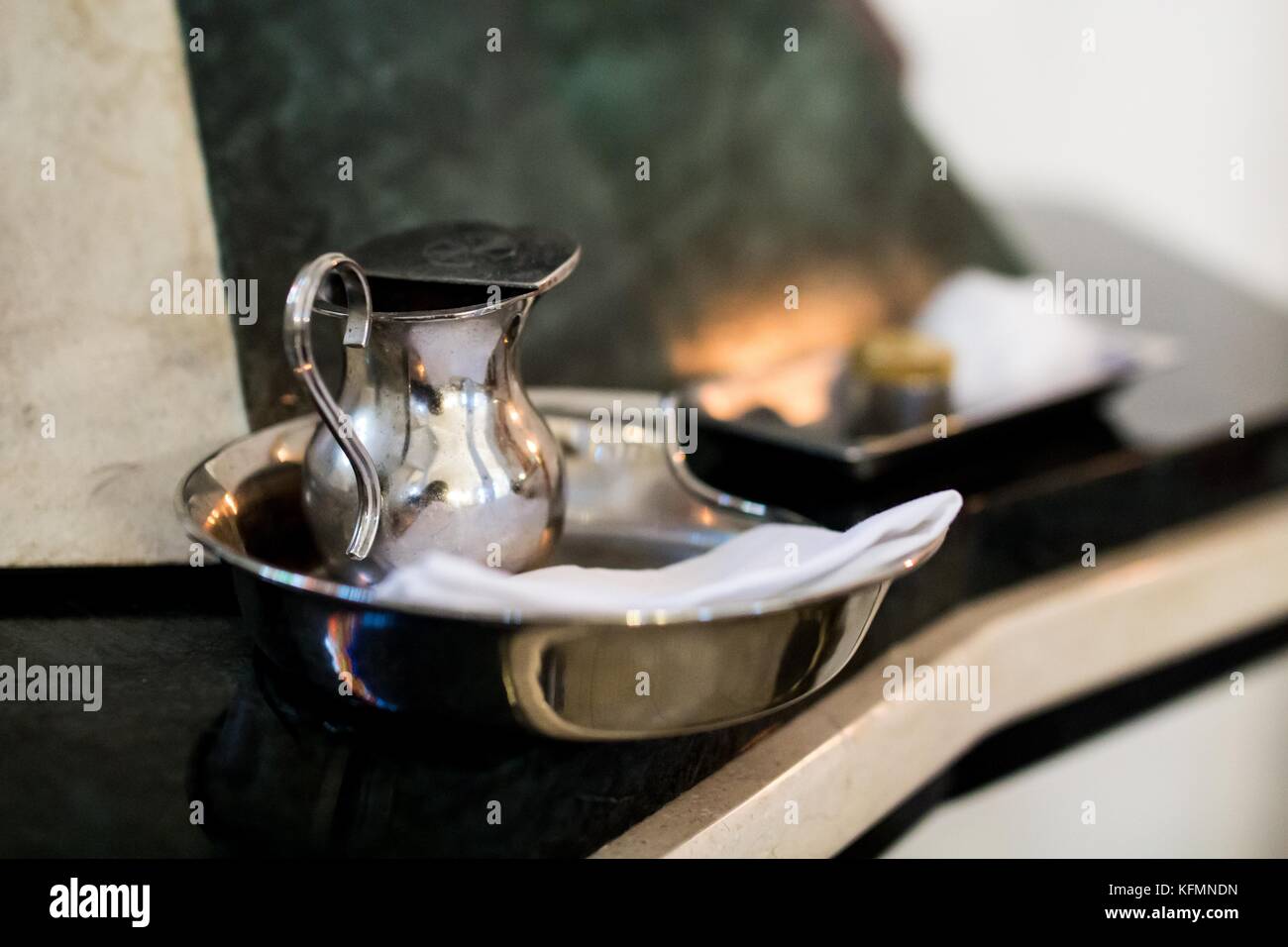 liturgical vessels for christening - baptismal font and jug Stock Photo ...