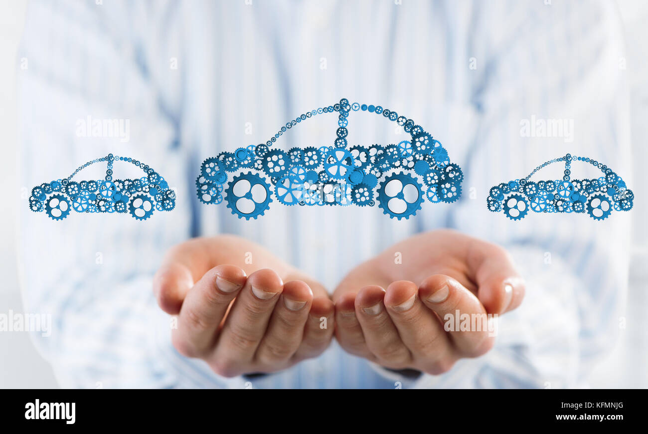 Close up of male hand showing car symbol made with gears and cogwheels ...