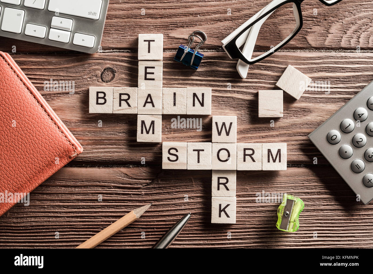 Conceptual business keywords on table with elements of game making ...