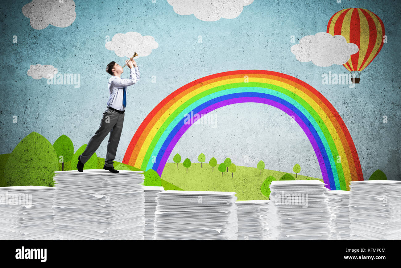 Happy businessman playing fife Stock Photo - Alamy