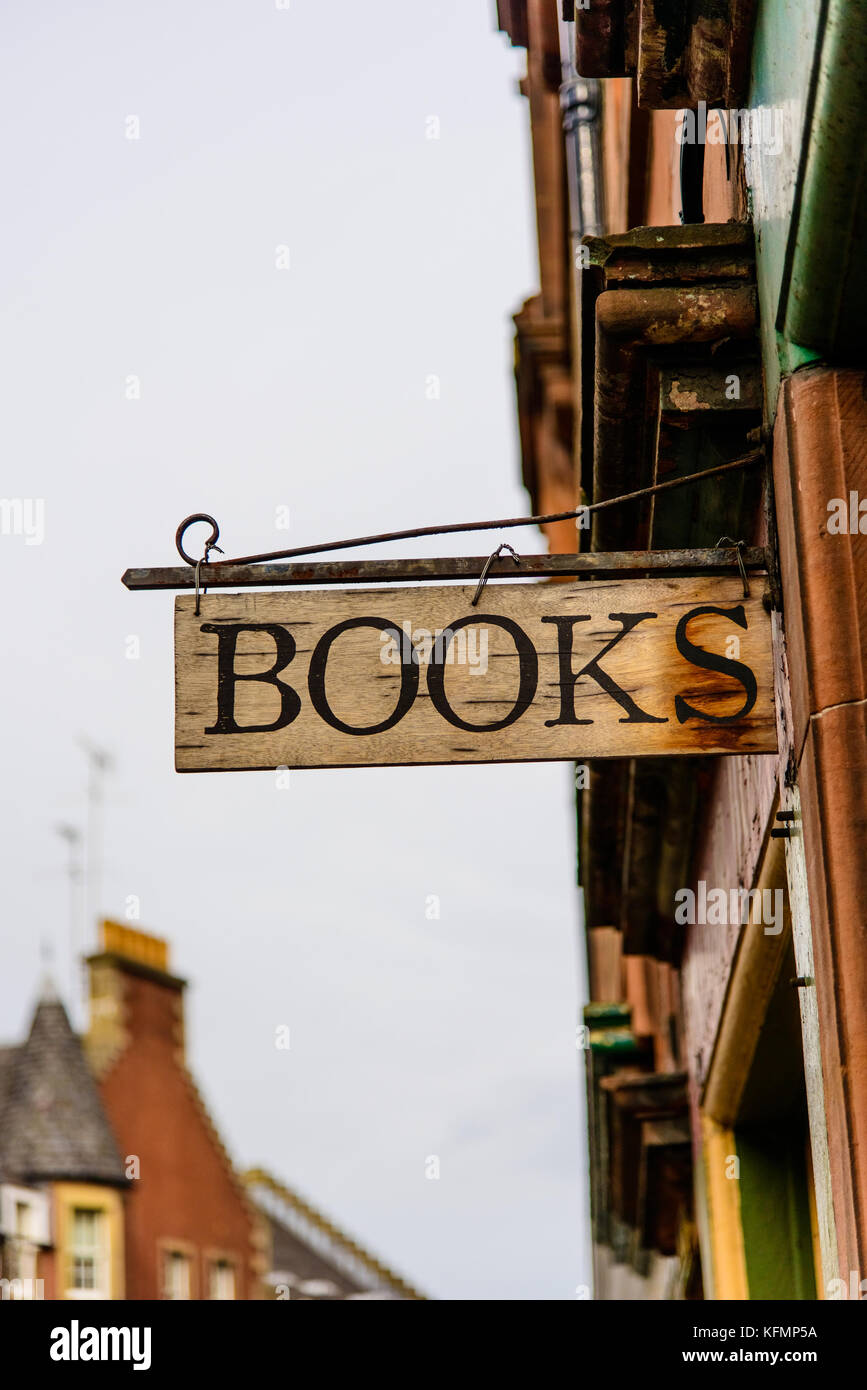 old fashioned hanging wooden bookshop sign Stock Photo - Alamy
