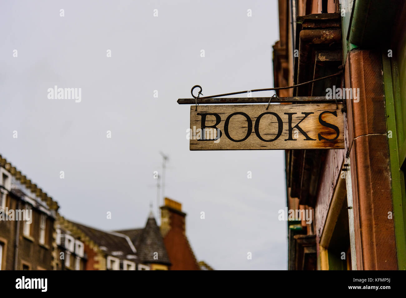 old fashioned hanging wooden bookshop sign Stock Photo - Alamy