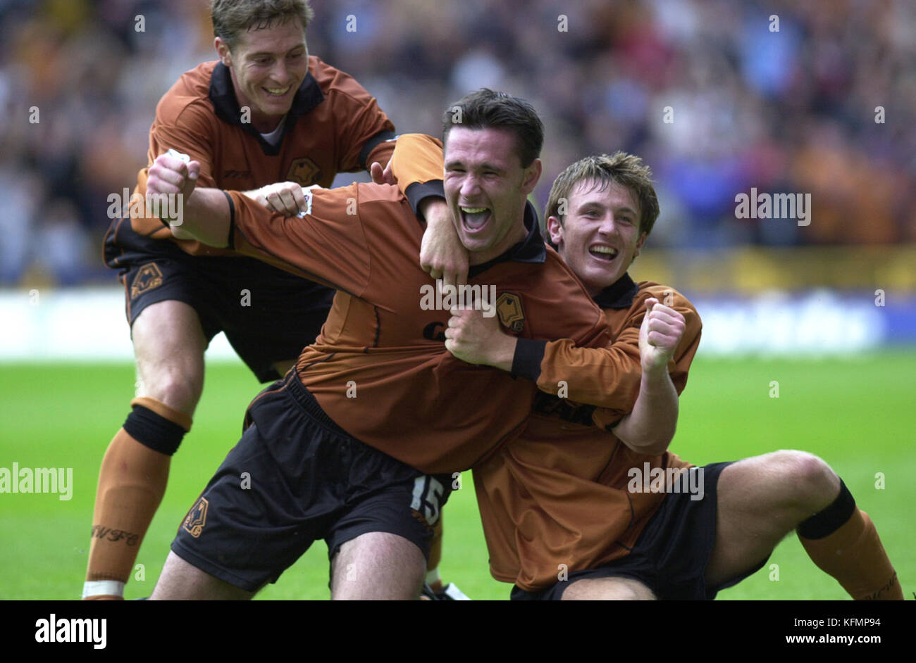Footballer Cedric Roussel celebrating goal with Tony Dinning and Lee ...