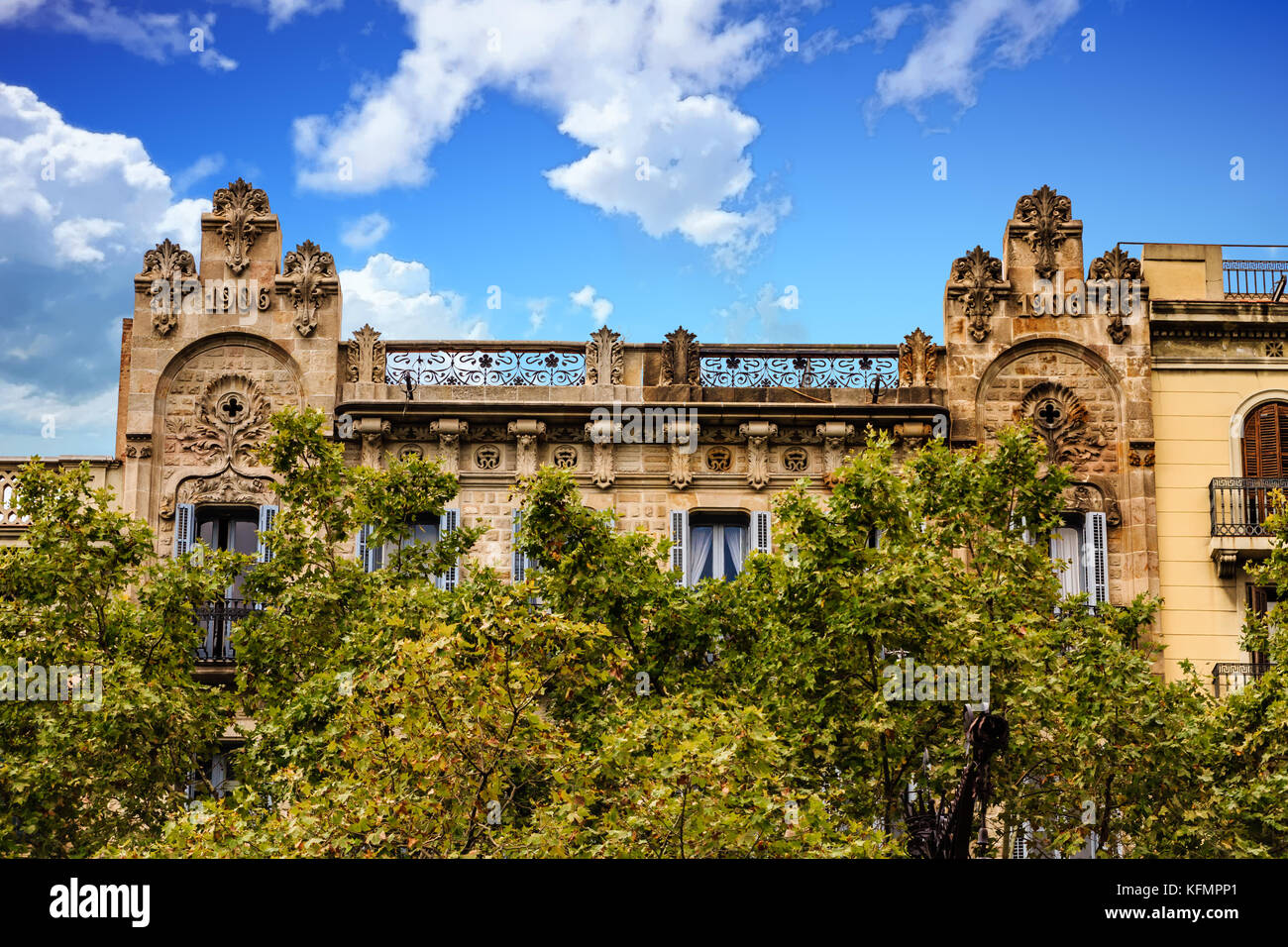 Old Barcelona Building from 1906 behind trees Stock Photo - Alamy