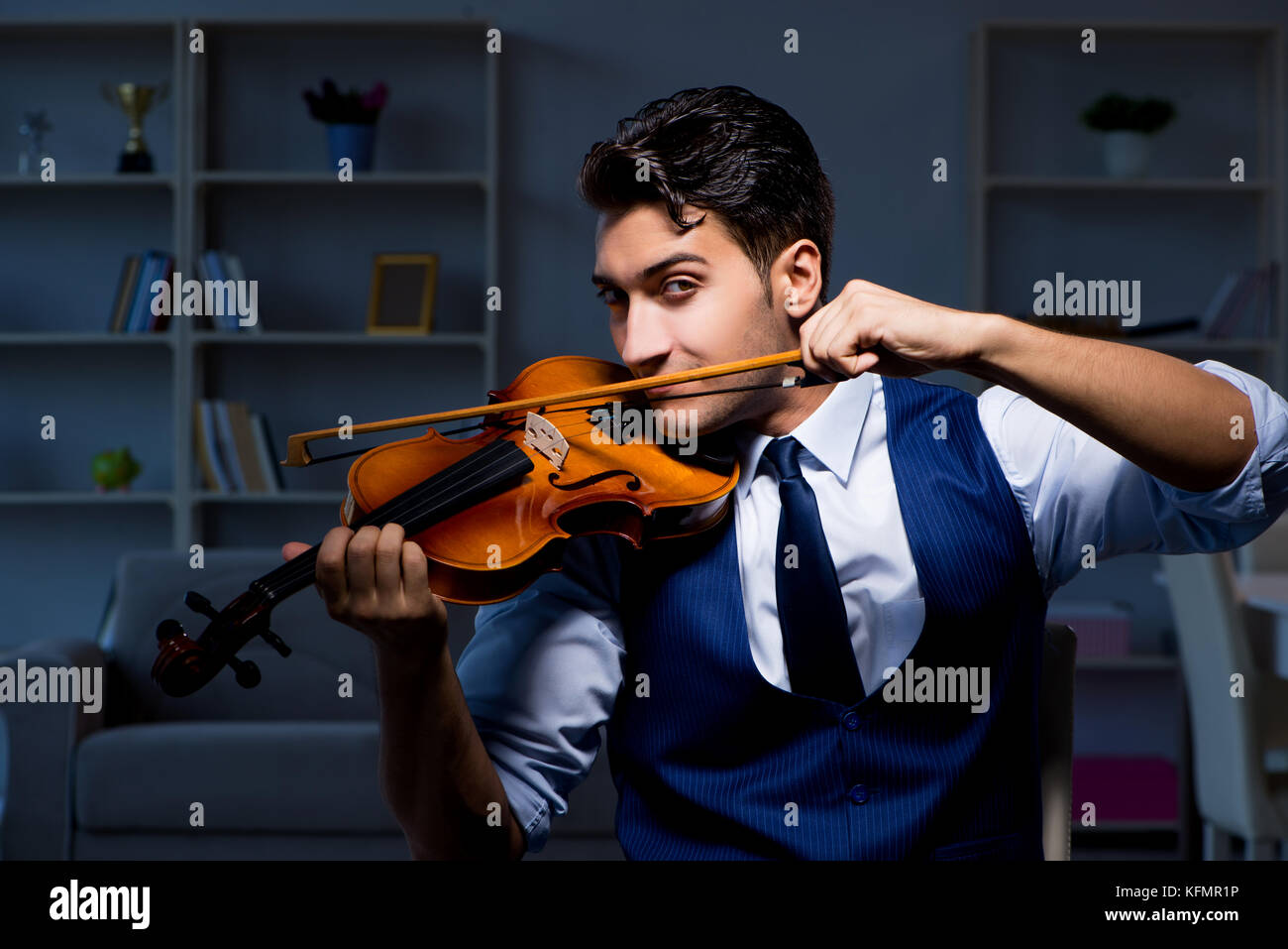 Young musician man practicing playing violin at home Stock Photo - Alamy