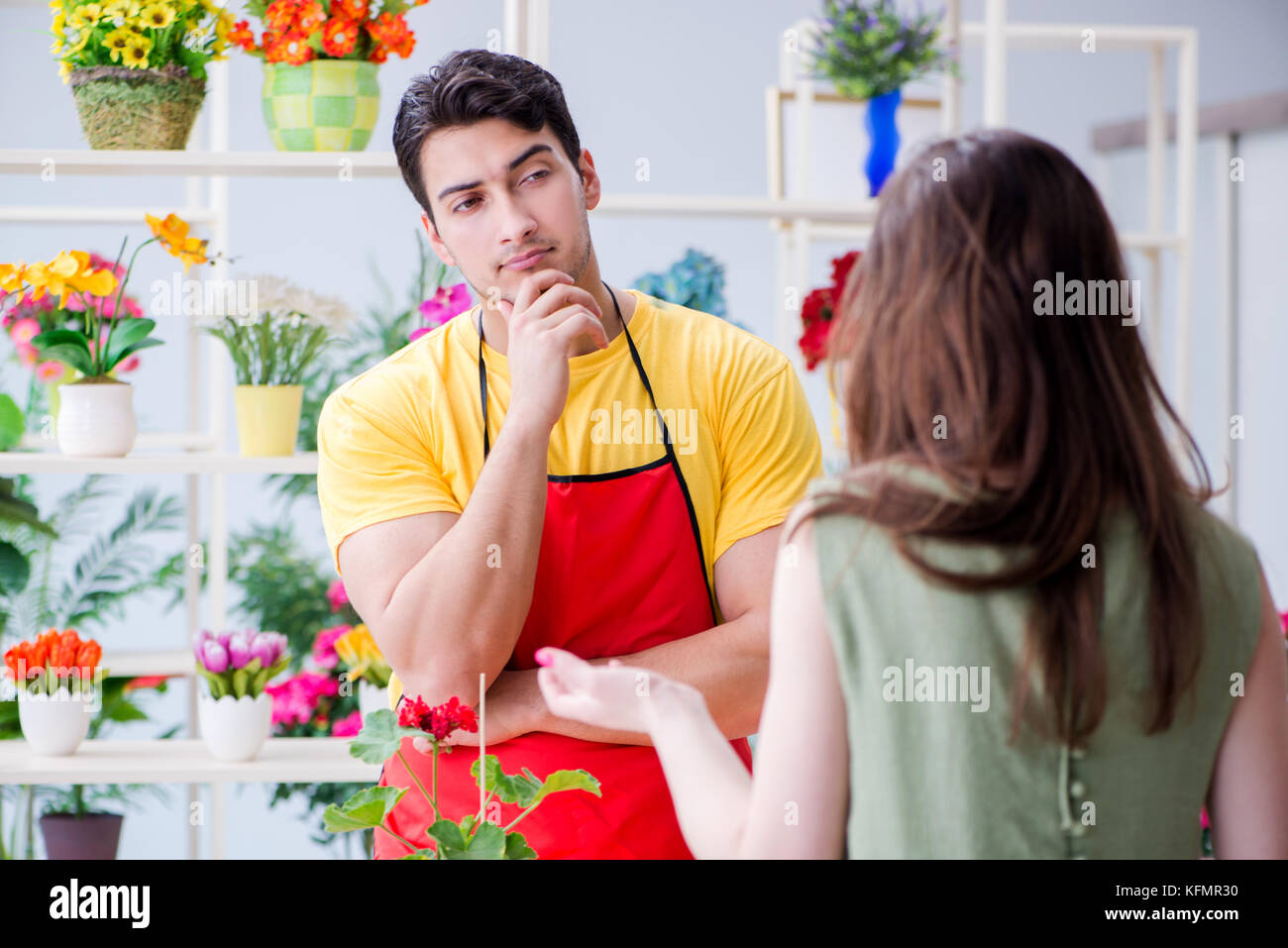 Florist selling flowers in a flower shop Stock Photo - Alamy