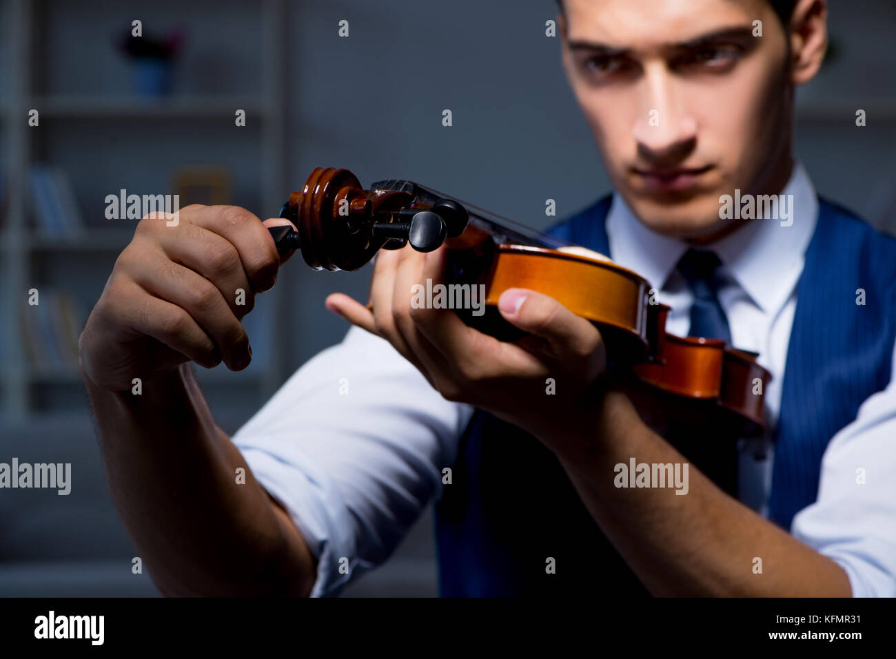 Young musician man practicing playing violin at home Stock Photo - Alamy