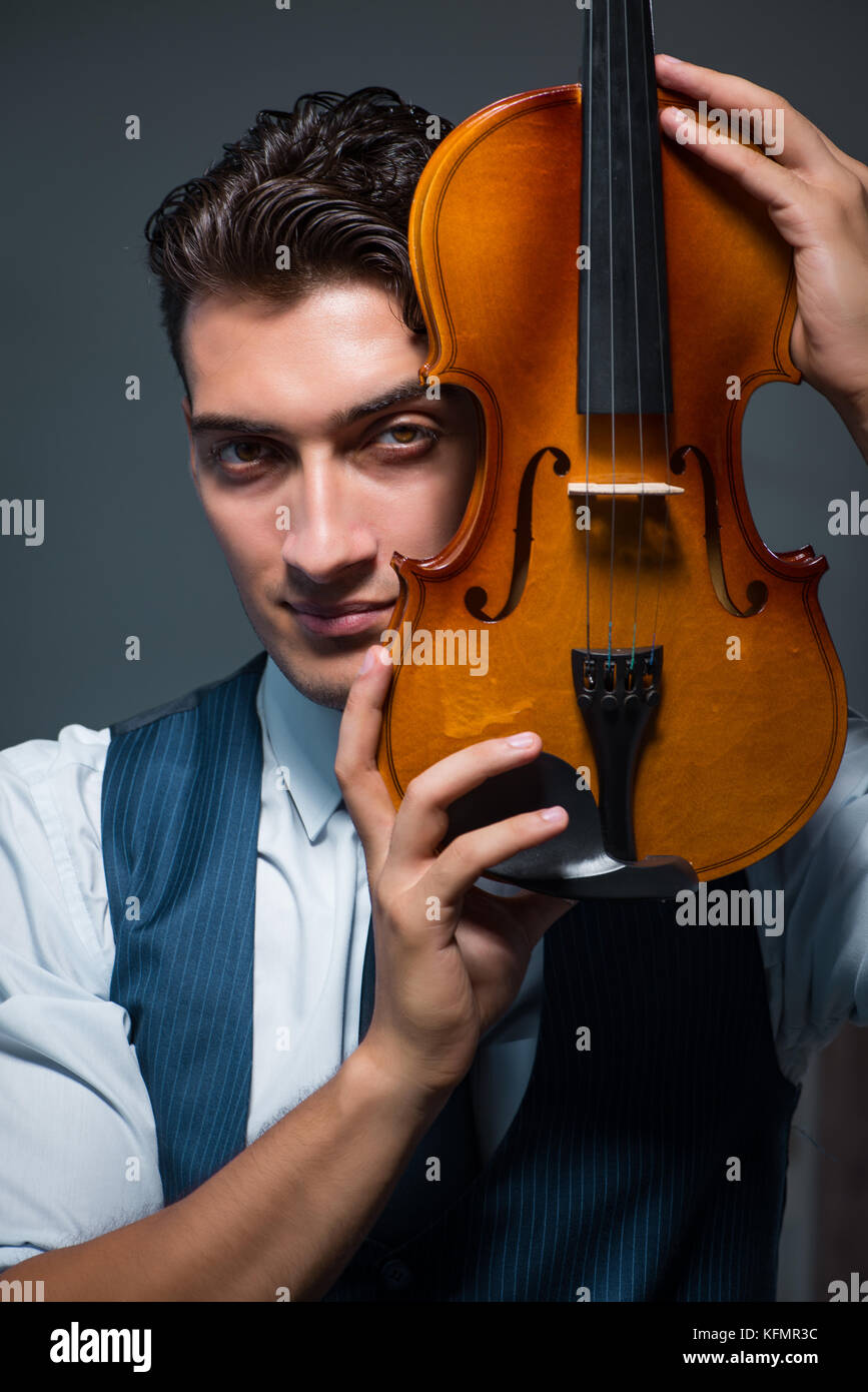 Young musician man practicing playing violin at home Stock Photo - Alamy