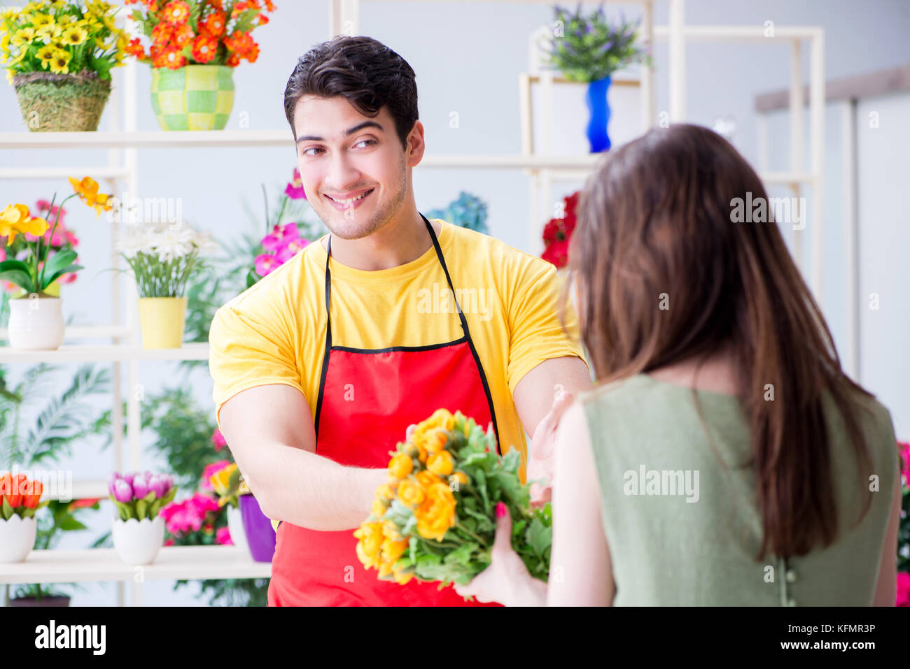 Florist selling flowers in a flower shop Stock Photo - Alamy