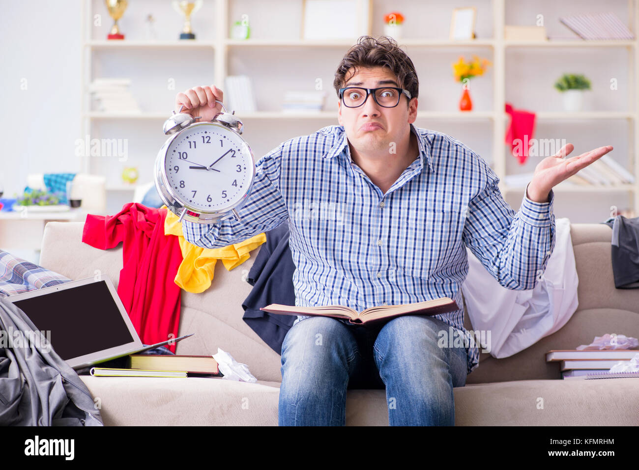 Young man working studying in messy room Stock Photo - Alamy