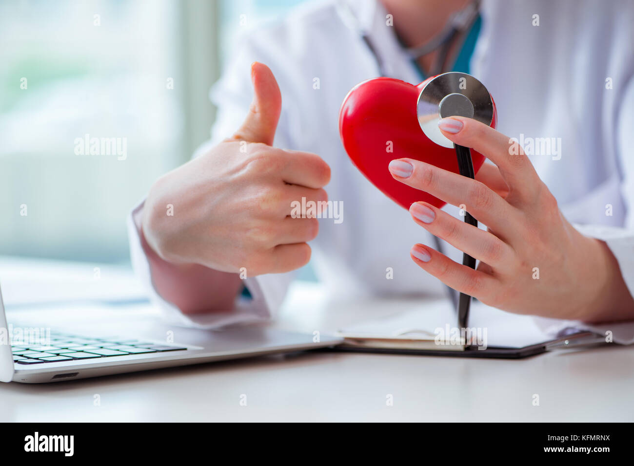 Doctor checking up heart in medical concept Stock Photo - Alamy