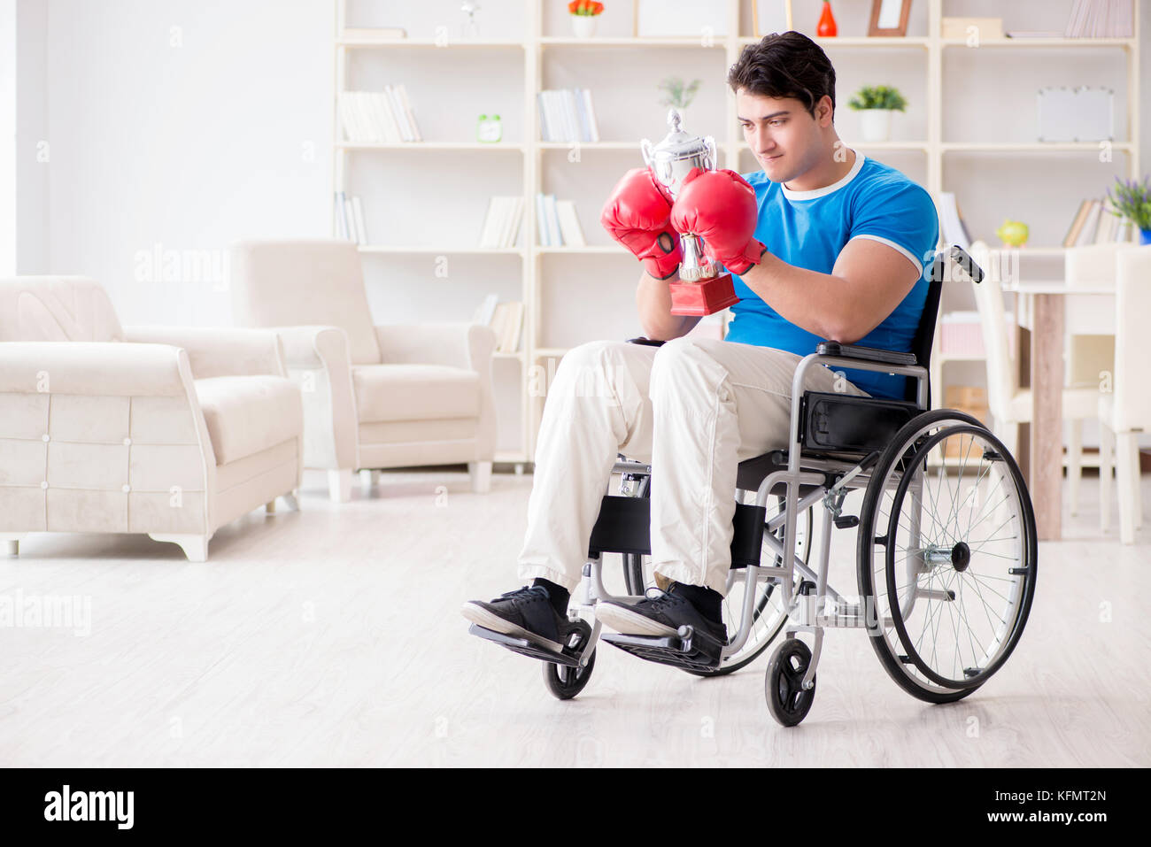 Disabled boxer at wheelchair recovering from injury Stock Photo - Alamy