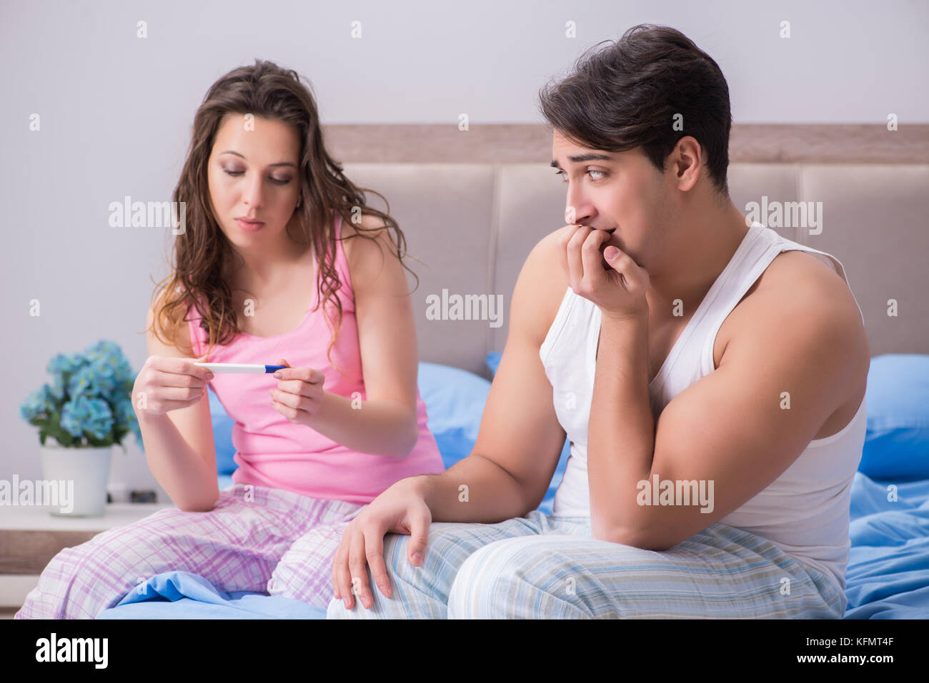 Young family with pregnancy test results Stock Photo - Alamy