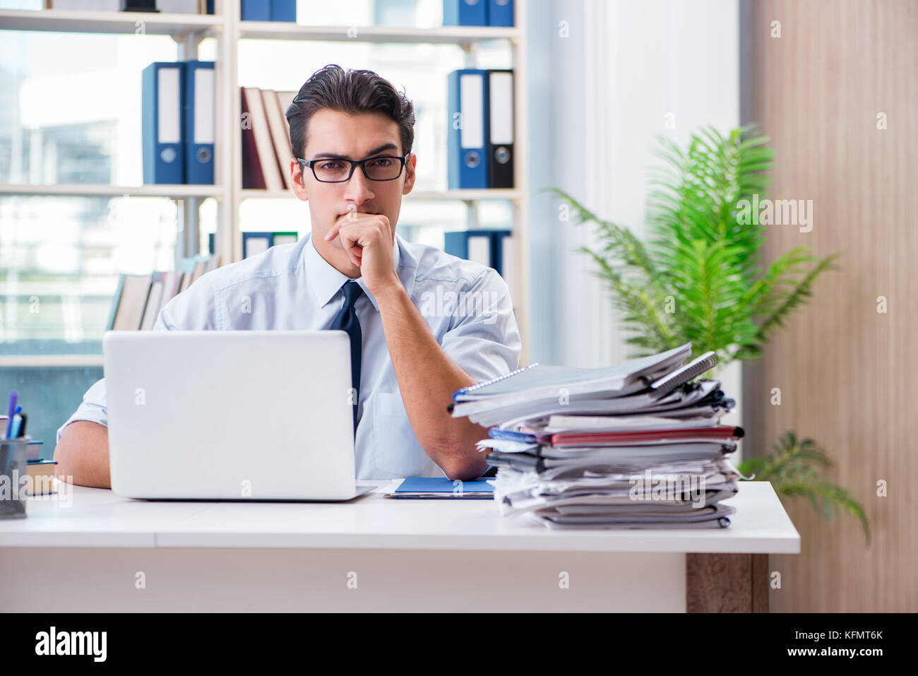 Businessman with excessive work paperwork working in office Stock Photo ...