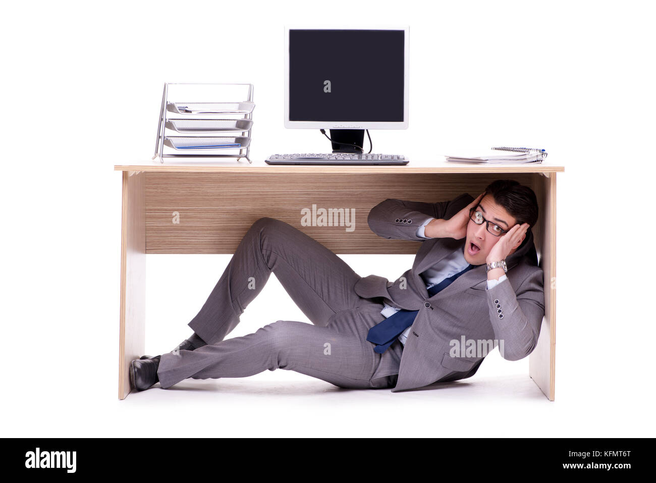 Businessman hiding in the ofice Stock Photo - Alamy