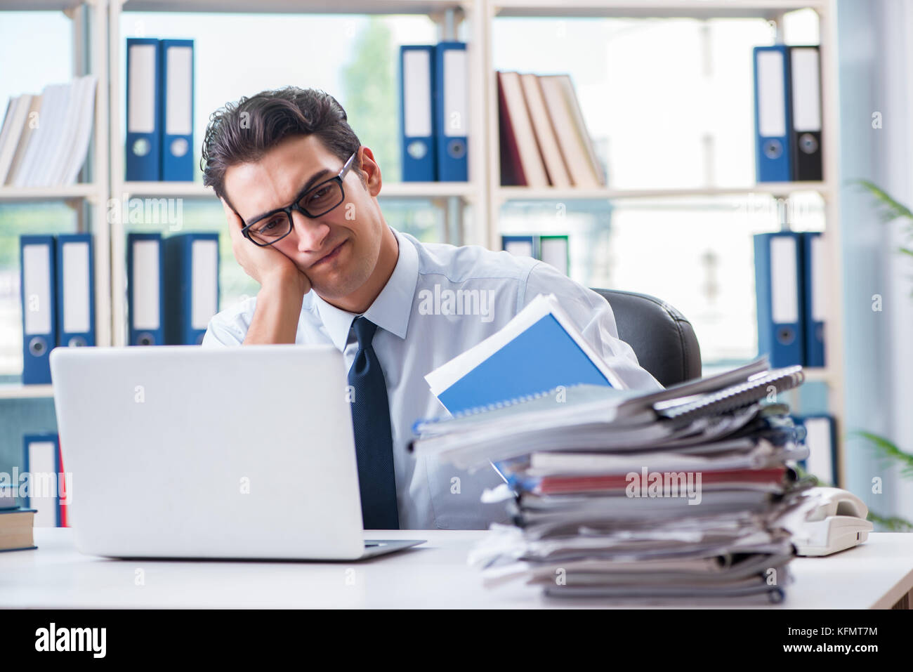 Businessman with excessive work paperwork working in office Stock Photo ...