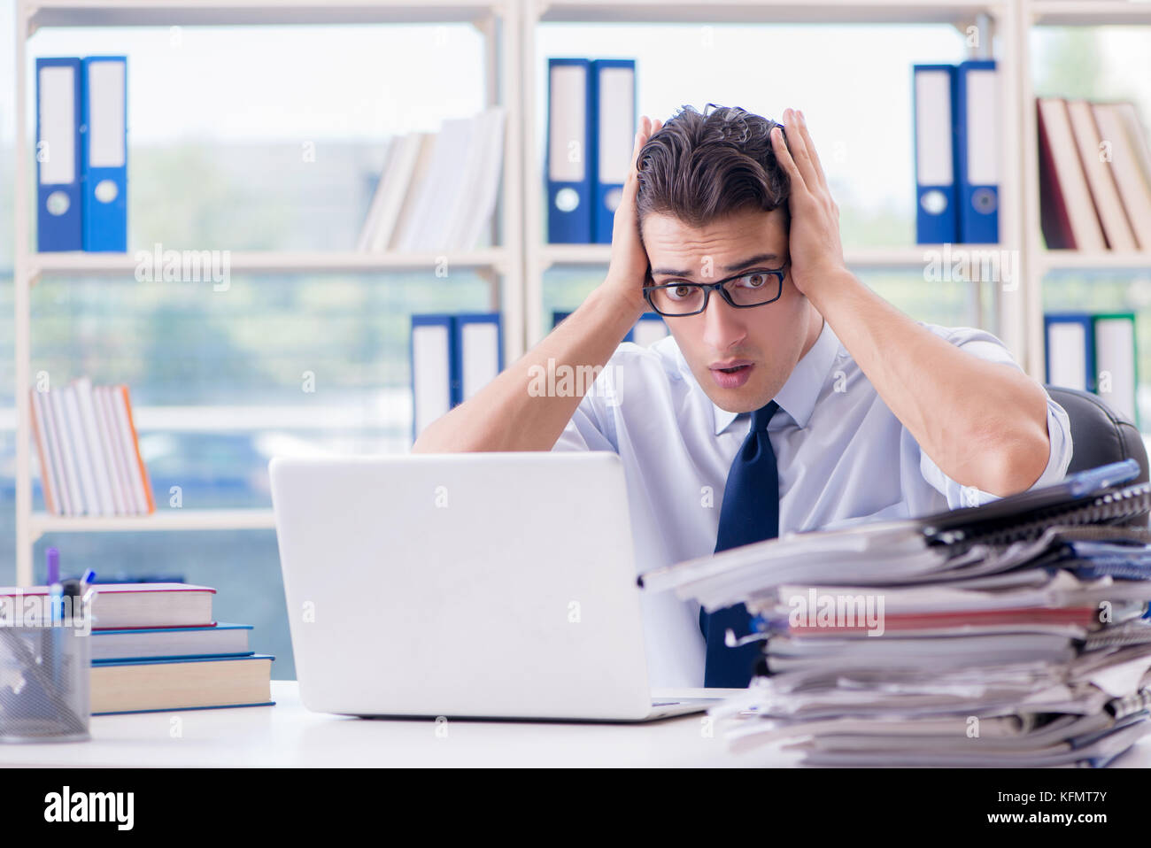Businessman with excessive work paperwork working in office Stock Photo ...
