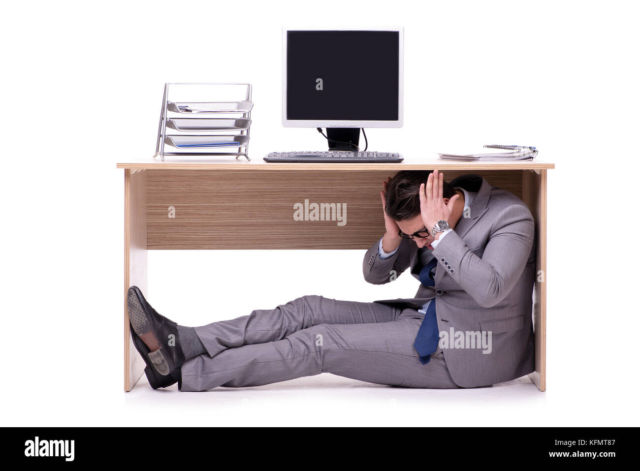Businessman hiding in the ofice Stock Photo - Alamy