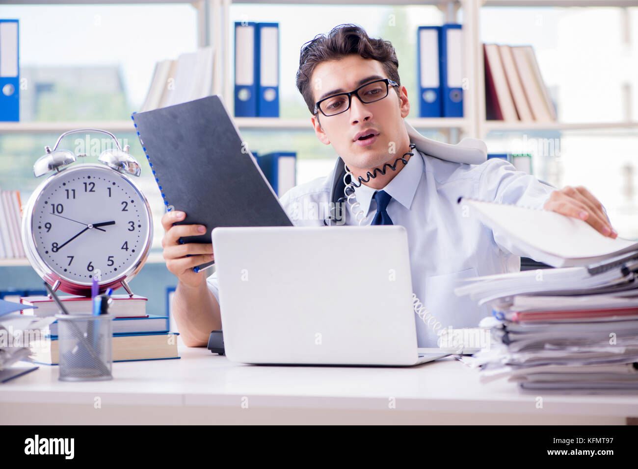 Businessman missing deadline for deliverables in office Stock Photo - Alamy