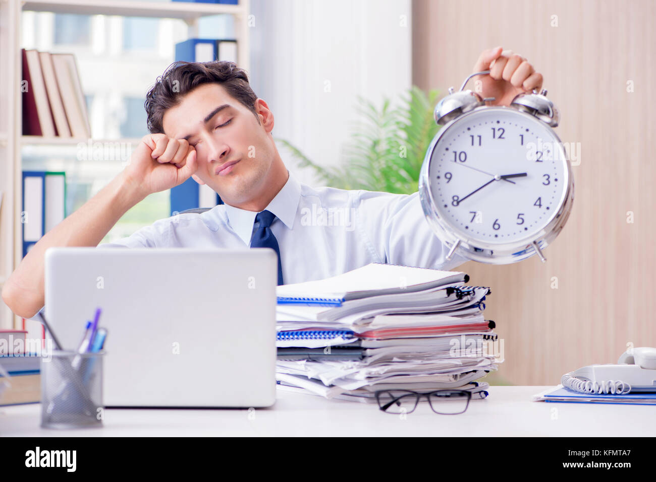 Businessman missing deadline for deliverables in office Stock Photo - Alamy
