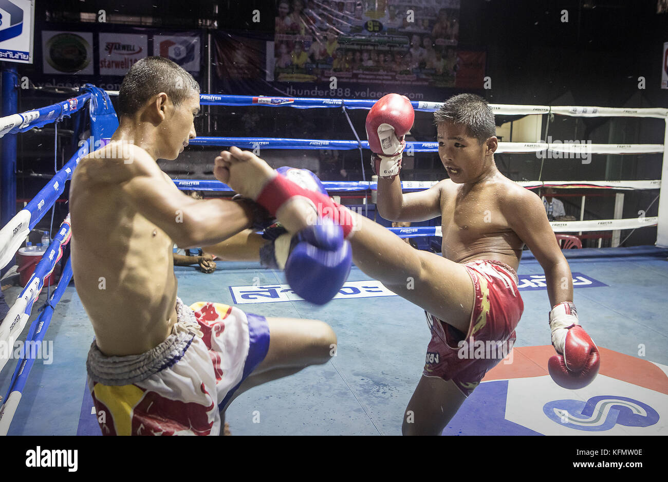 Hitting. Boys, Muay Thai boxers fighting, Paktonchai, Korat, Thailand ...