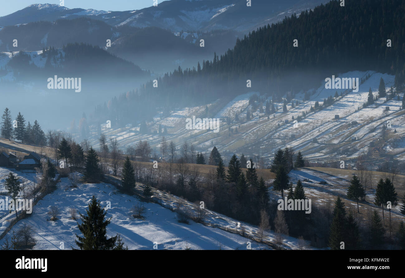 Eastern european winter landscape in a small Romanian mountain village ...