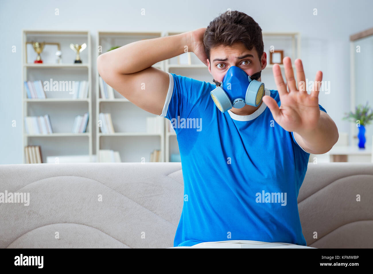 Man sweating excessively smelling bad at home Stock Photo - Alamy