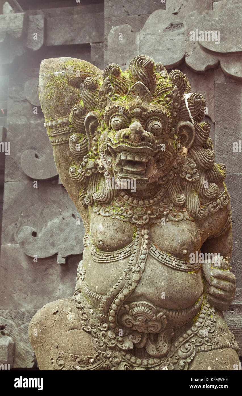 Balinese stone statue carving Stock Photo - Alamy