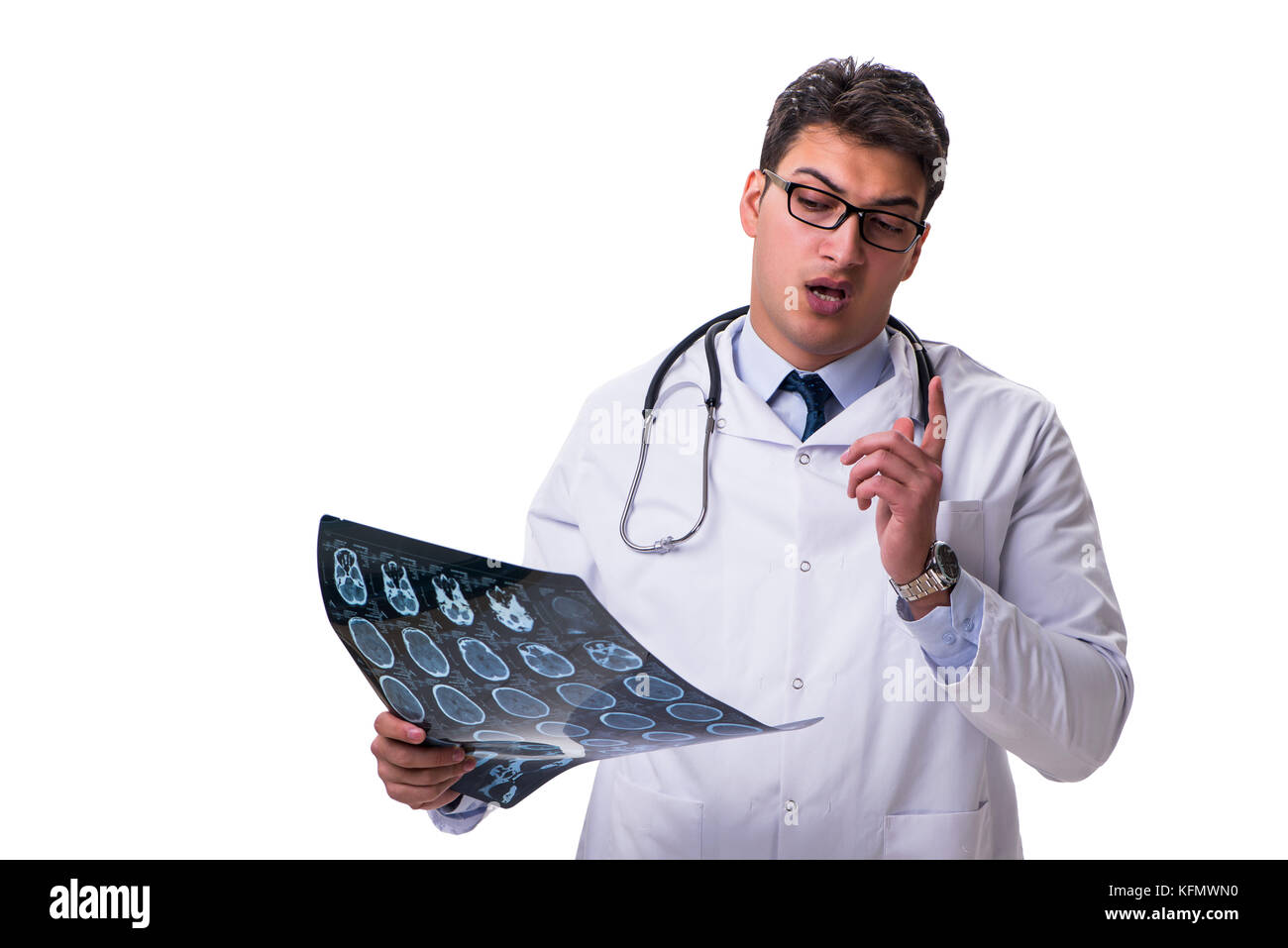 Young male doctor holding a radiograph isolated on white background ...
