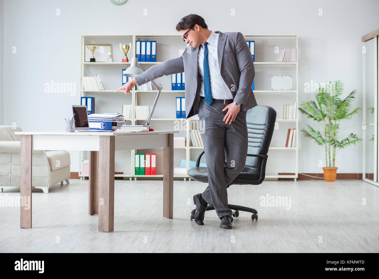 Businessman having fun taking a break in the office at work Stock Photo ...