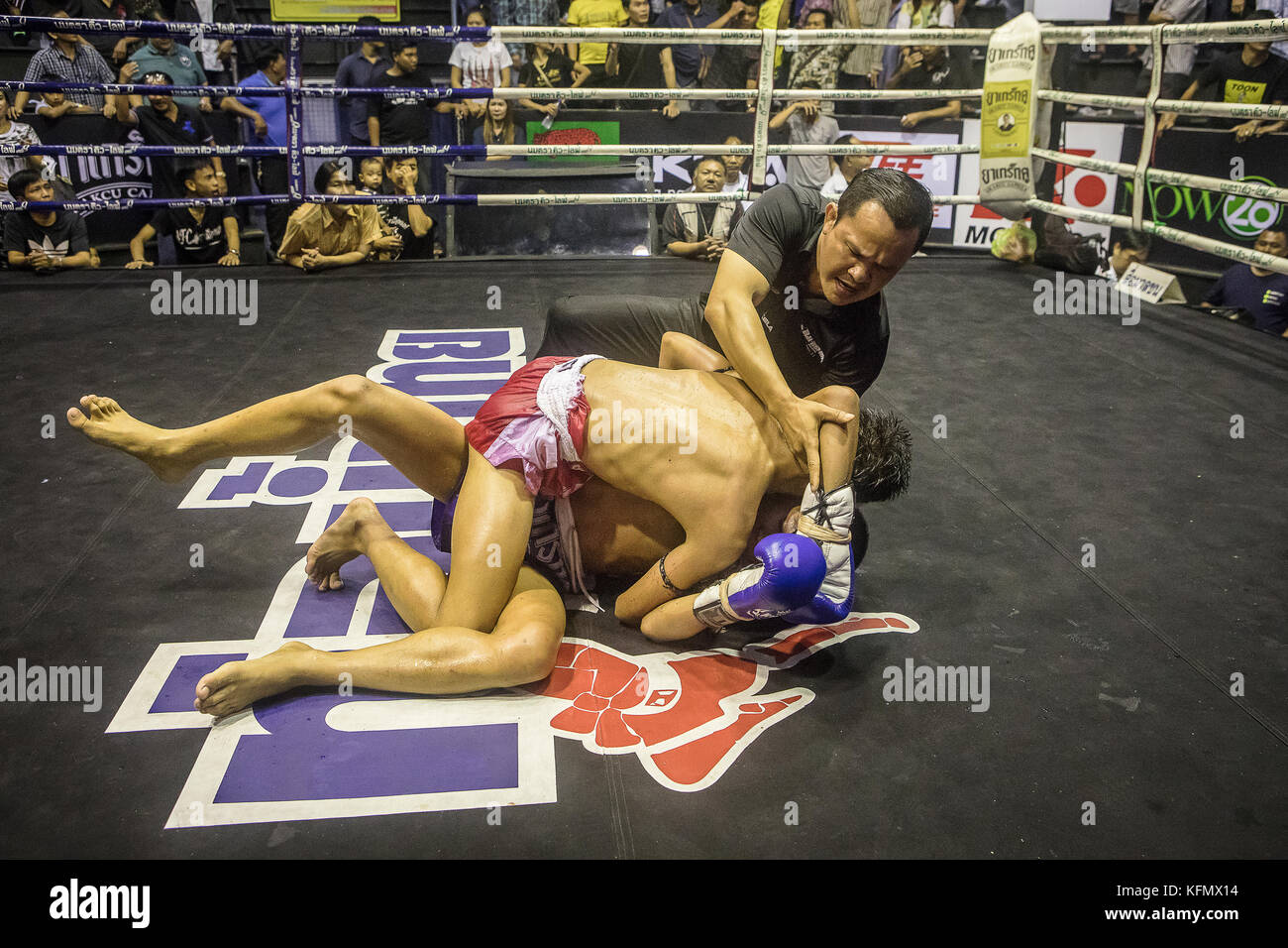 Boys, Muay Thai boxers fighting and referee, Bangkok, Thailand Stock ...