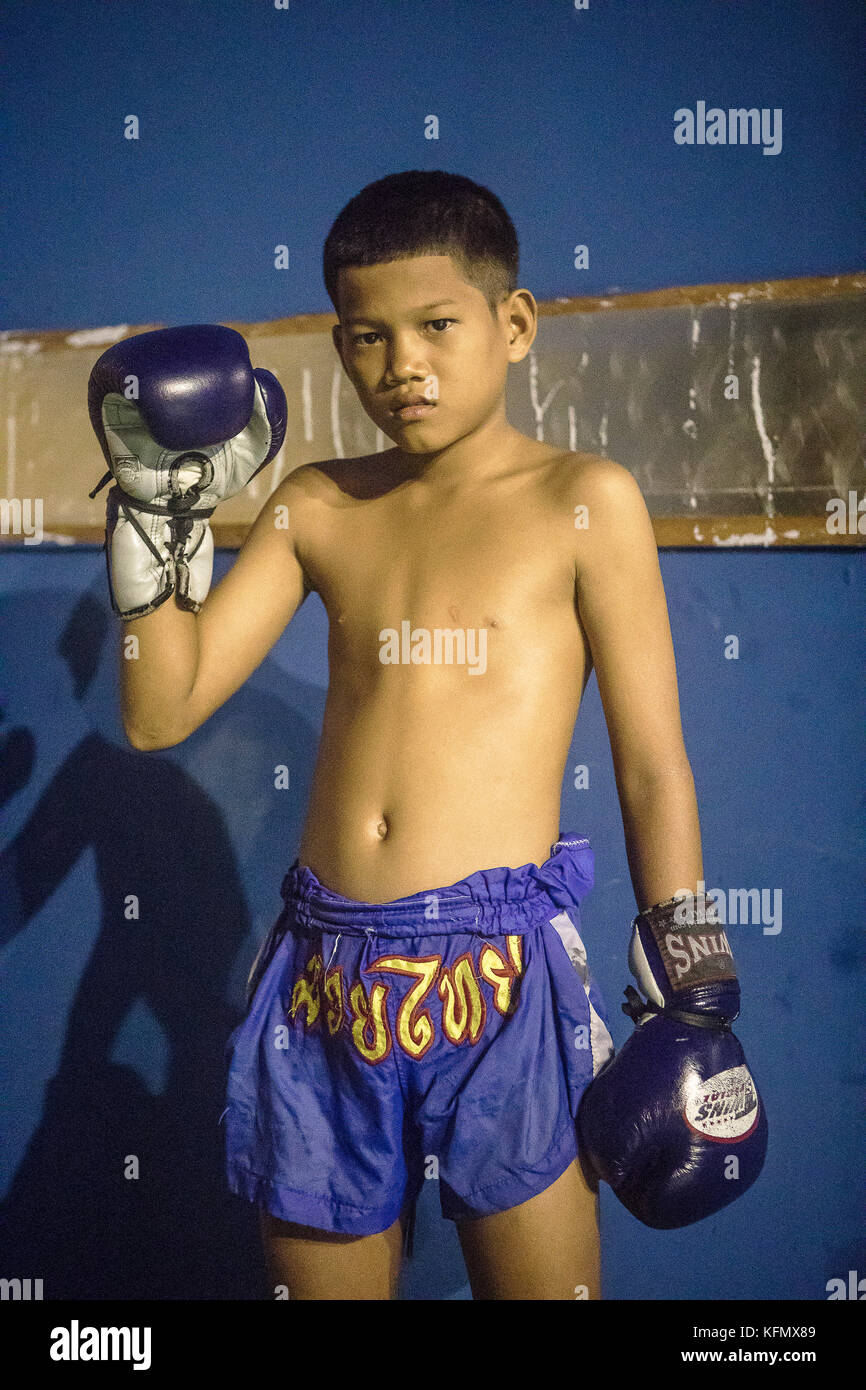 Khunsenk, 13 year old, Muay Thai boxer preparing hands, Bangkok ...