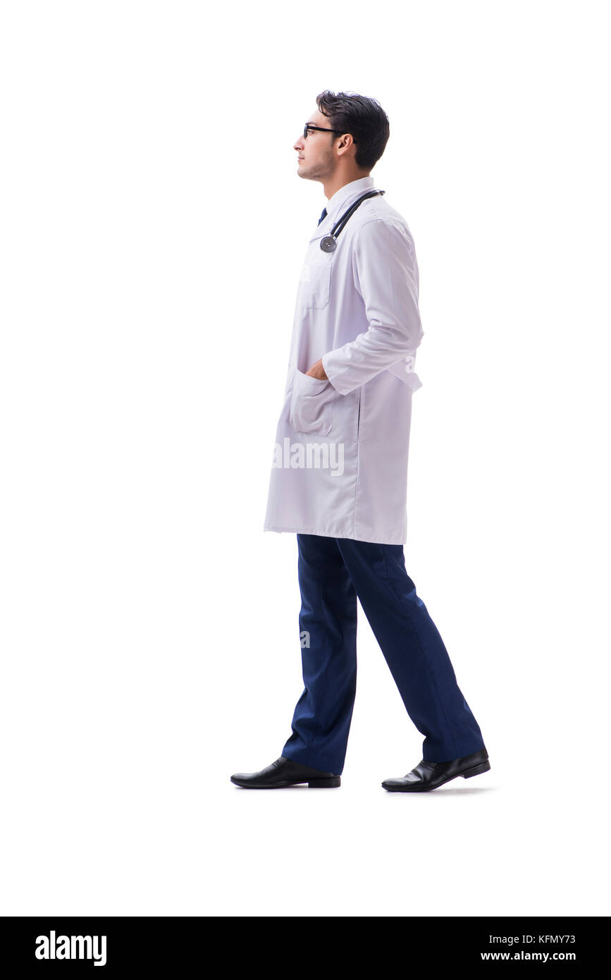 Young doctor physician standing walking isolated on white background ...