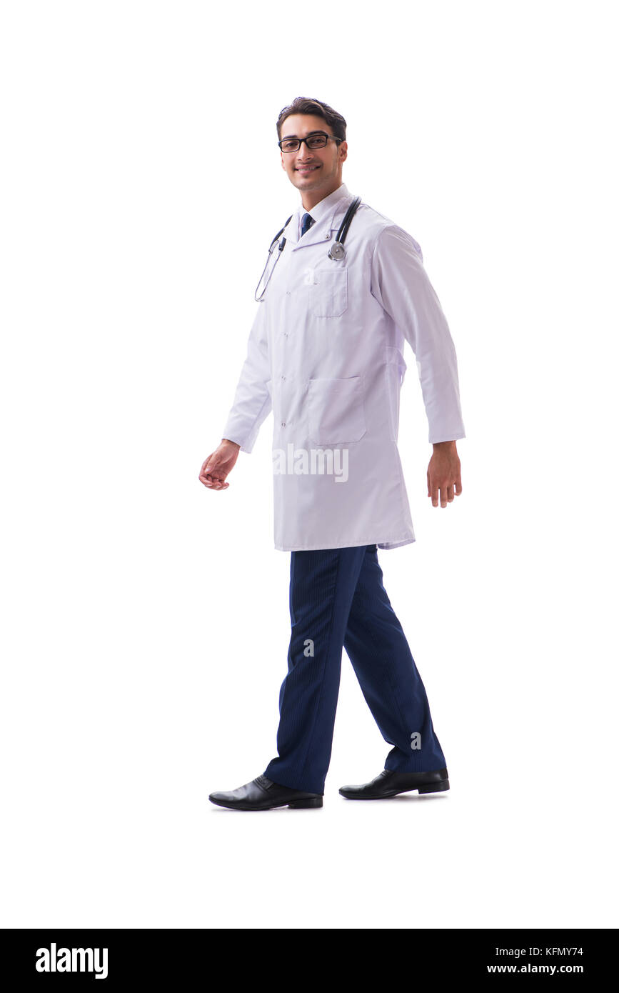 Young doctor physician standing walking isolated on white background ...