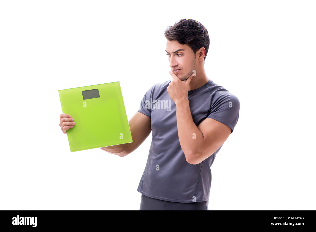 Man with scales in sports and health concept isolated on white Stock ...