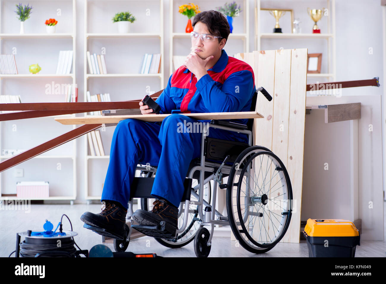 Disabled carpenter working in workshop Stock Photo - Alamy
