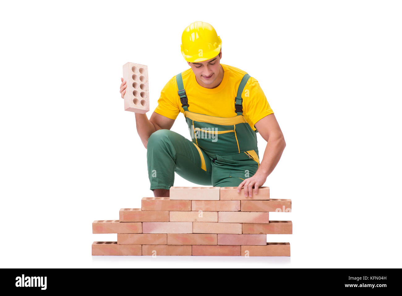 The handsome construction worker building brick wall Stock Photo - Alamy