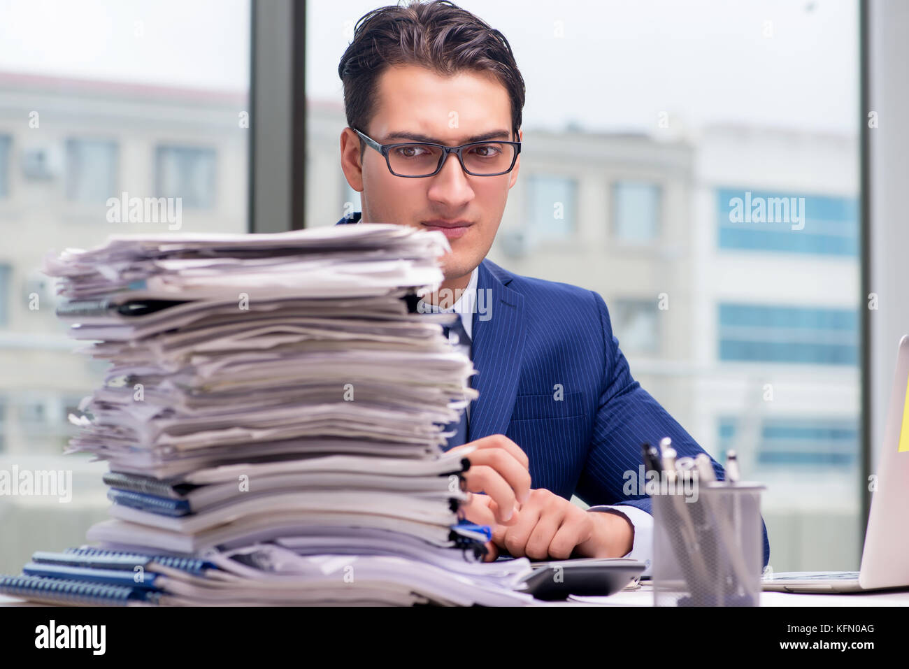 Workaholic businessman overworked with too much work in office Stock ...