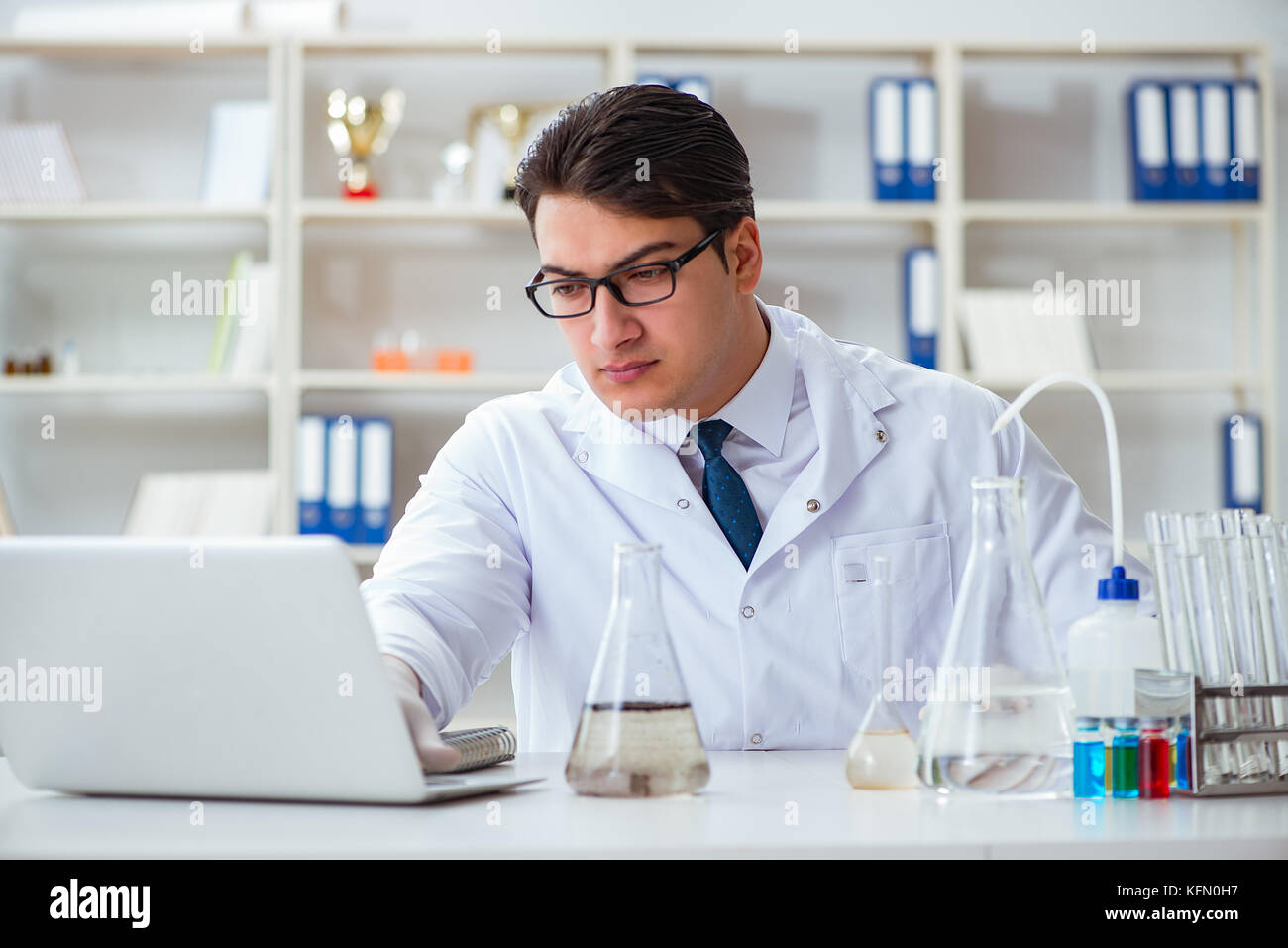 Young researcher scientist doing a water test contamination experiment ...