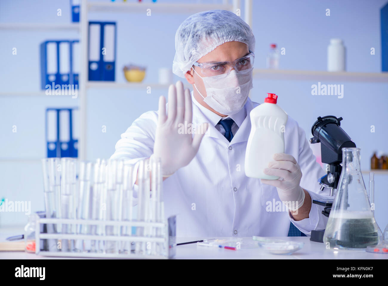 Man in the lab testing new cleaning solution detergent Stock Photo - Alamy