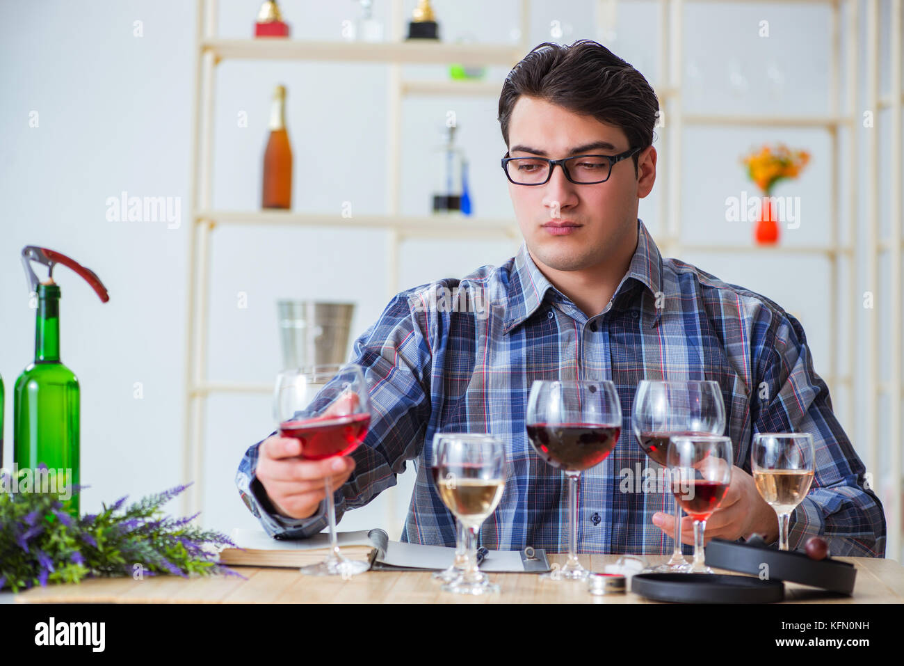 Professional sommelier tasting red wine Stock Photo - Alamy