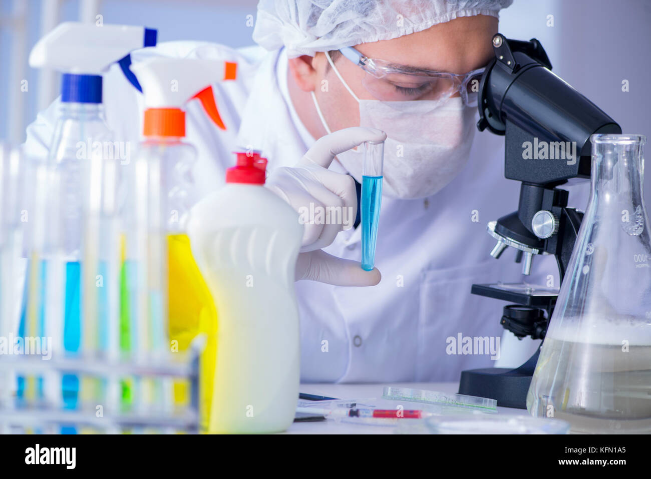 Man in the lab testing new cleaning solution detergent Stock Photo - Alamy