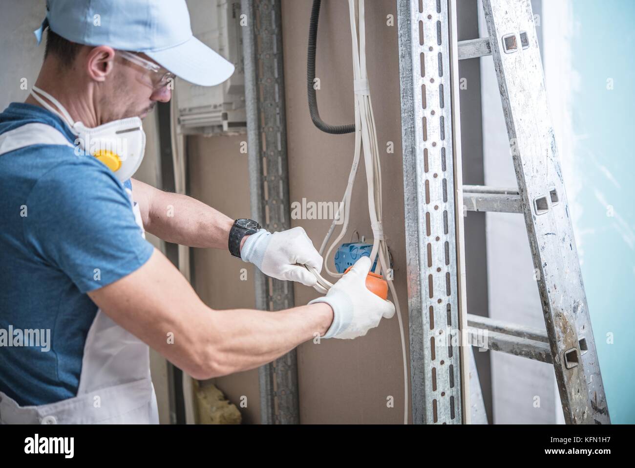 Electrical Installation Design. Caucasian Electrician Installing ...