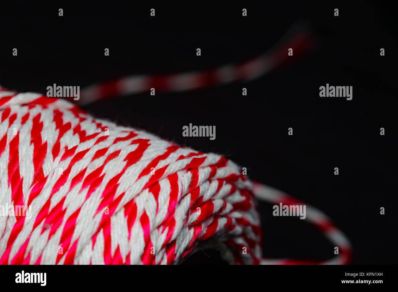 Red and white rope for the parcel bundle on black background Stock ...