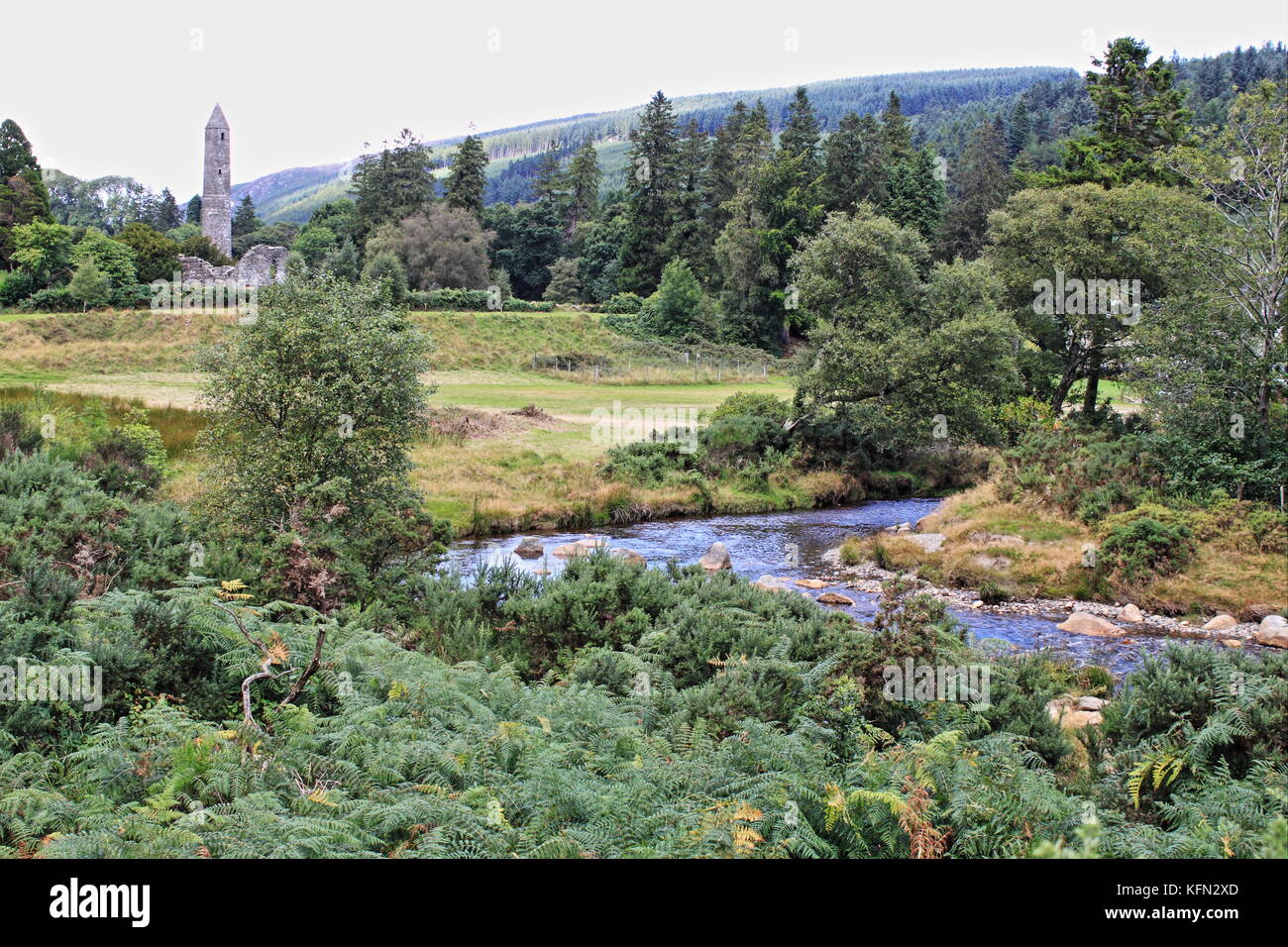 Monastic site with round tower in Glendalough, Ireland Stock Photo - Alamy